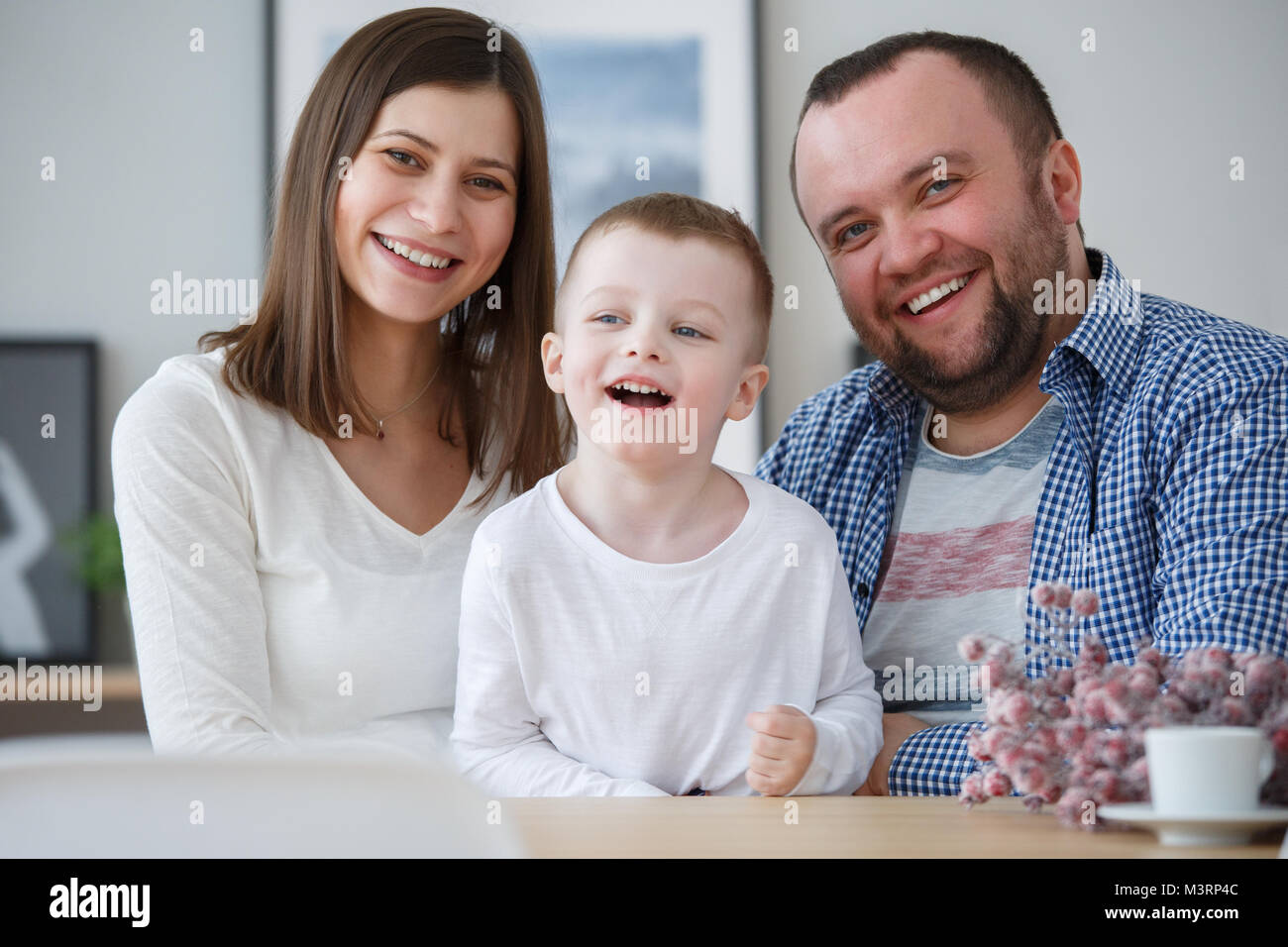 Image of happy family with her son in room Stock Photo - Alamy