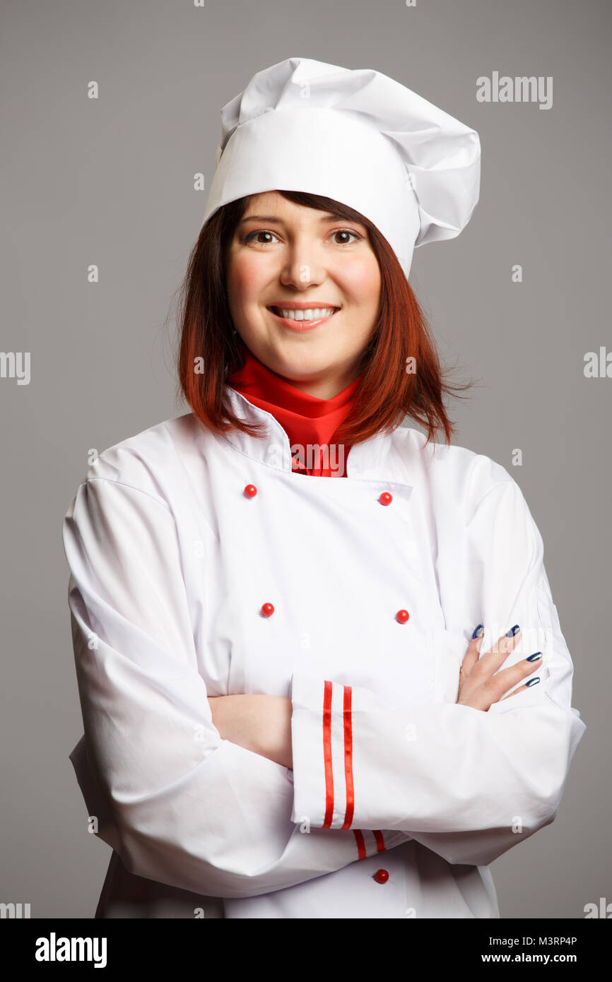Photo of cook girl in white robe and cap Stock Photo - Alamy