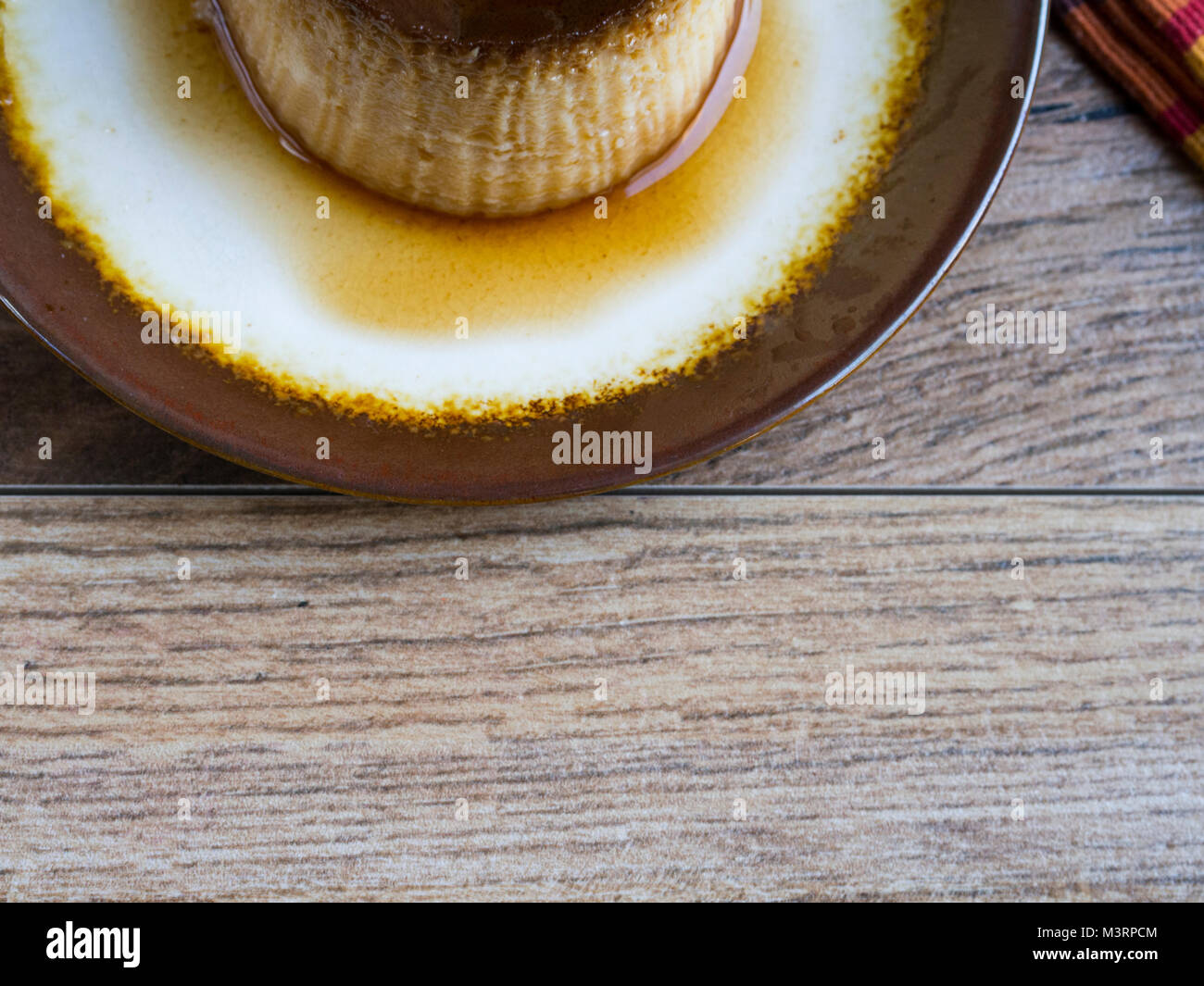 Flan on wood background Stock Photo - Alamy