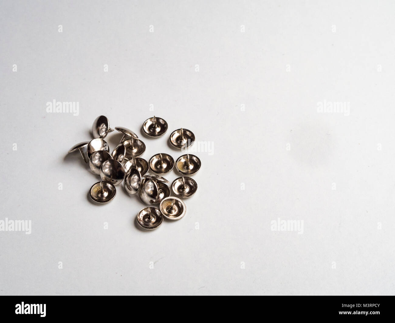 Group of metal pushpin on white background Stock Photo - Alamy