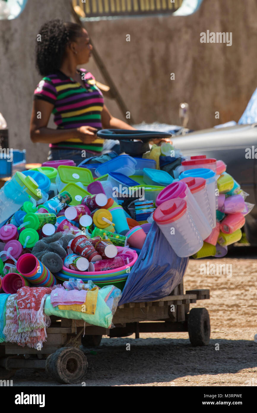 Market trader with colourful trolley full of goods at the Ocho Rios ...