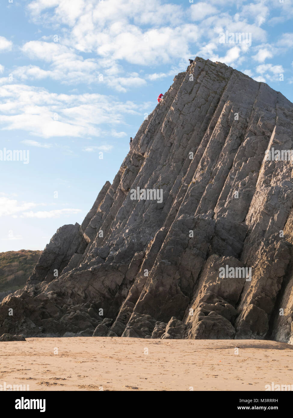Rock climbing on the Three Cliffs at Three Cliff Bay, South Wales Stock ...