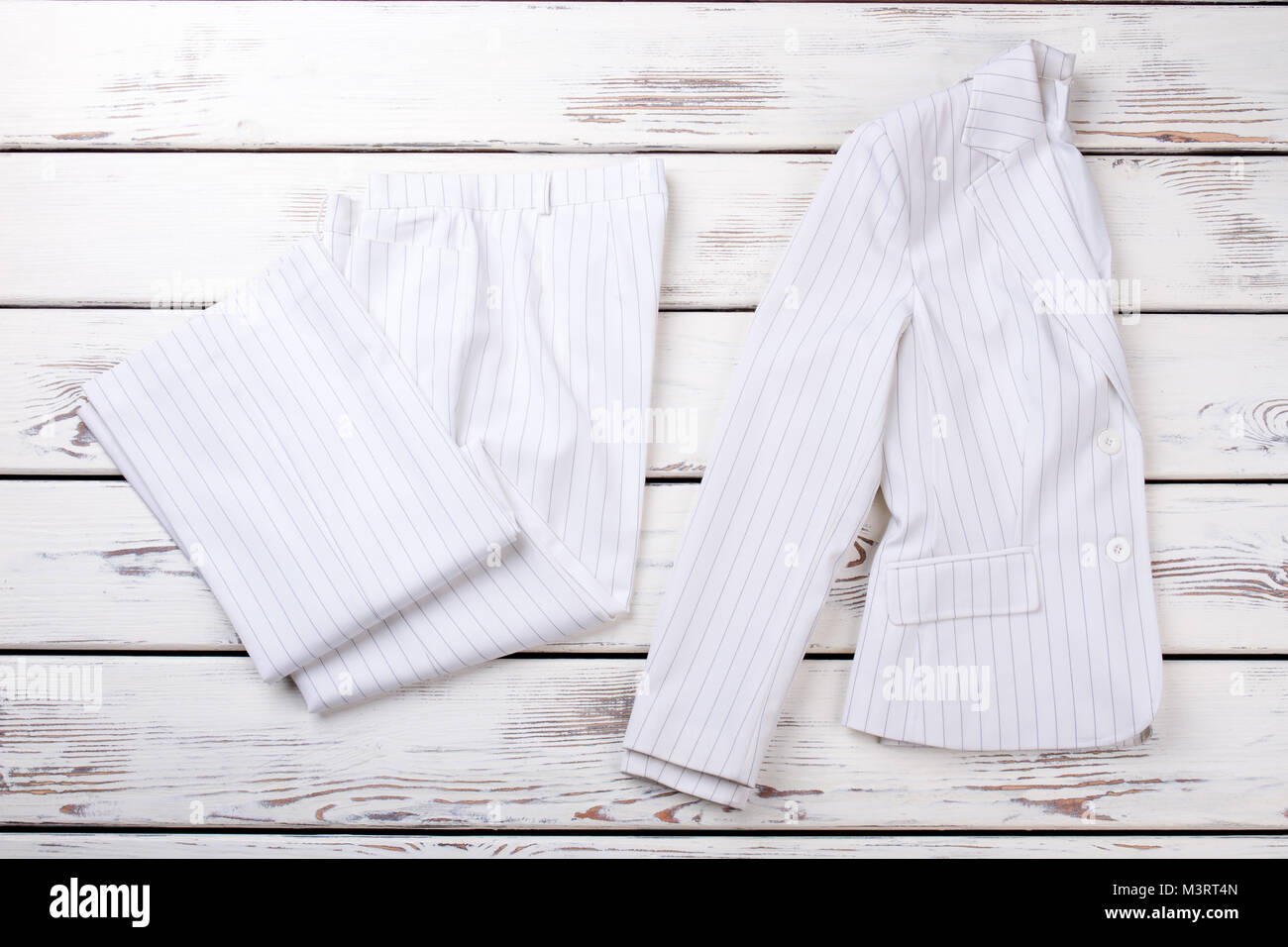 Ladies white formal suit, top view Stock Photo - Alamy