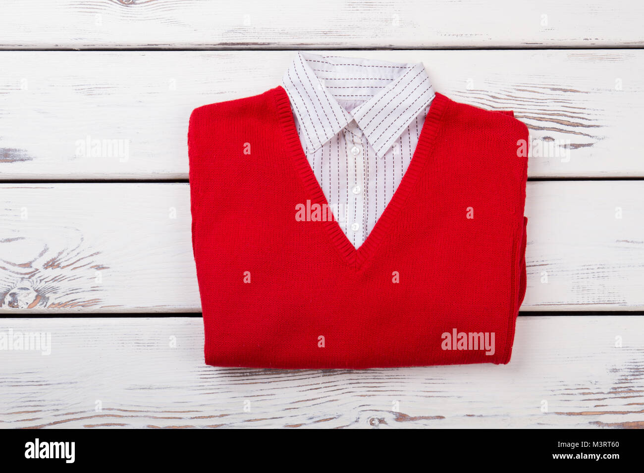Female red sweater with white collar Stock Photo - Alamy