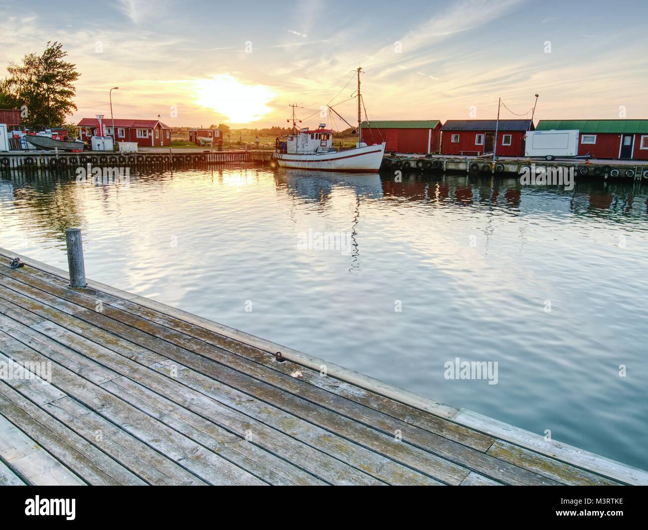 Small fishing port with boats anchored and moored on sea bay in Sweden ...
