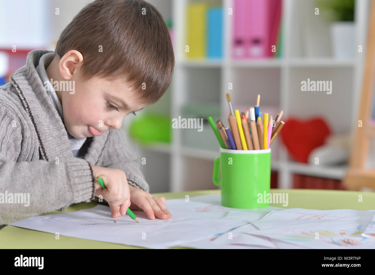 little boy drawing with pencil Stock Photo - Alamy
