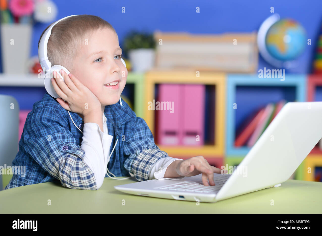 boy using laptop Stock Photo - Alamy