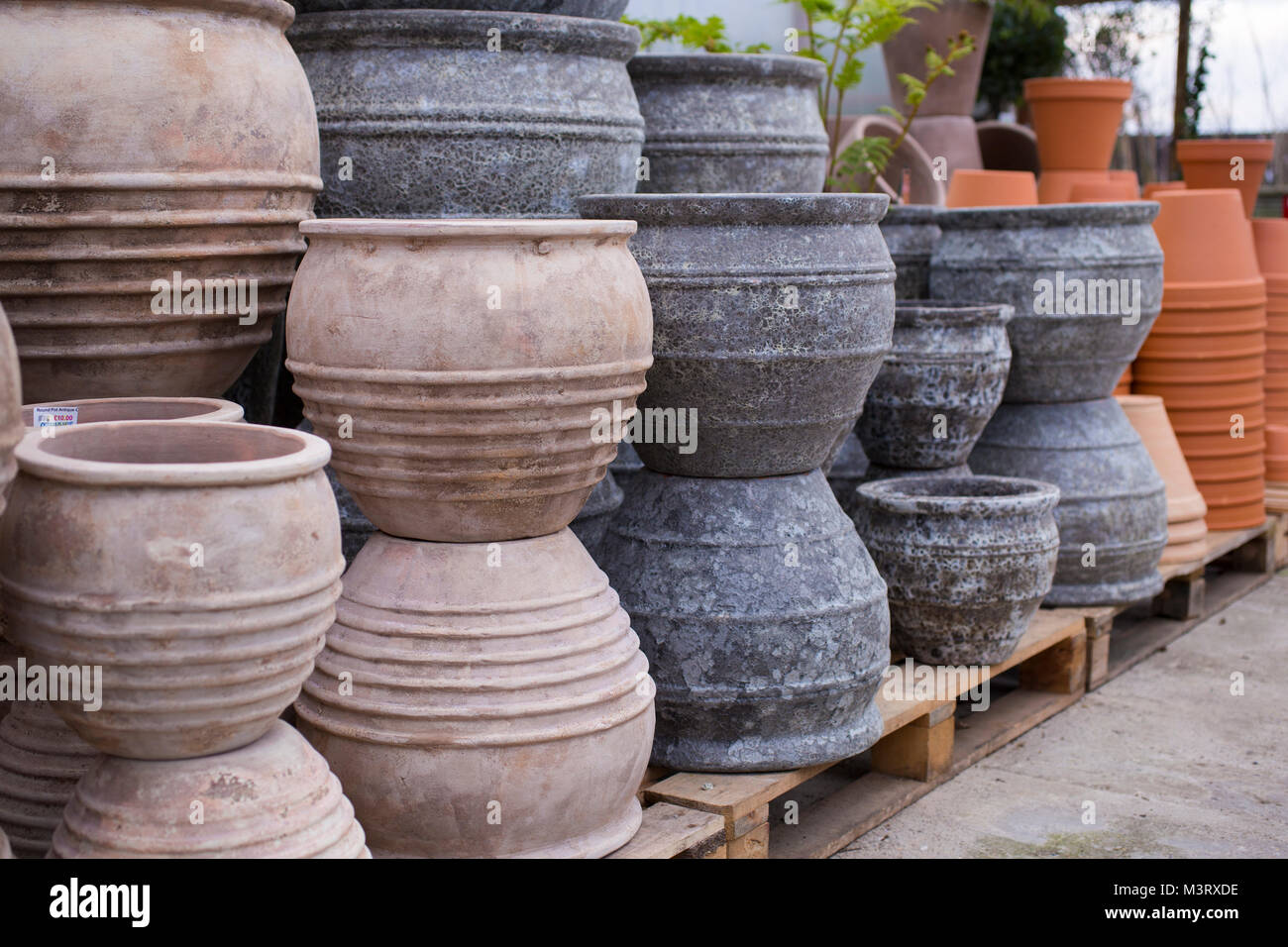 A variety of plant containers on display at a Garden Nursery Stock ...