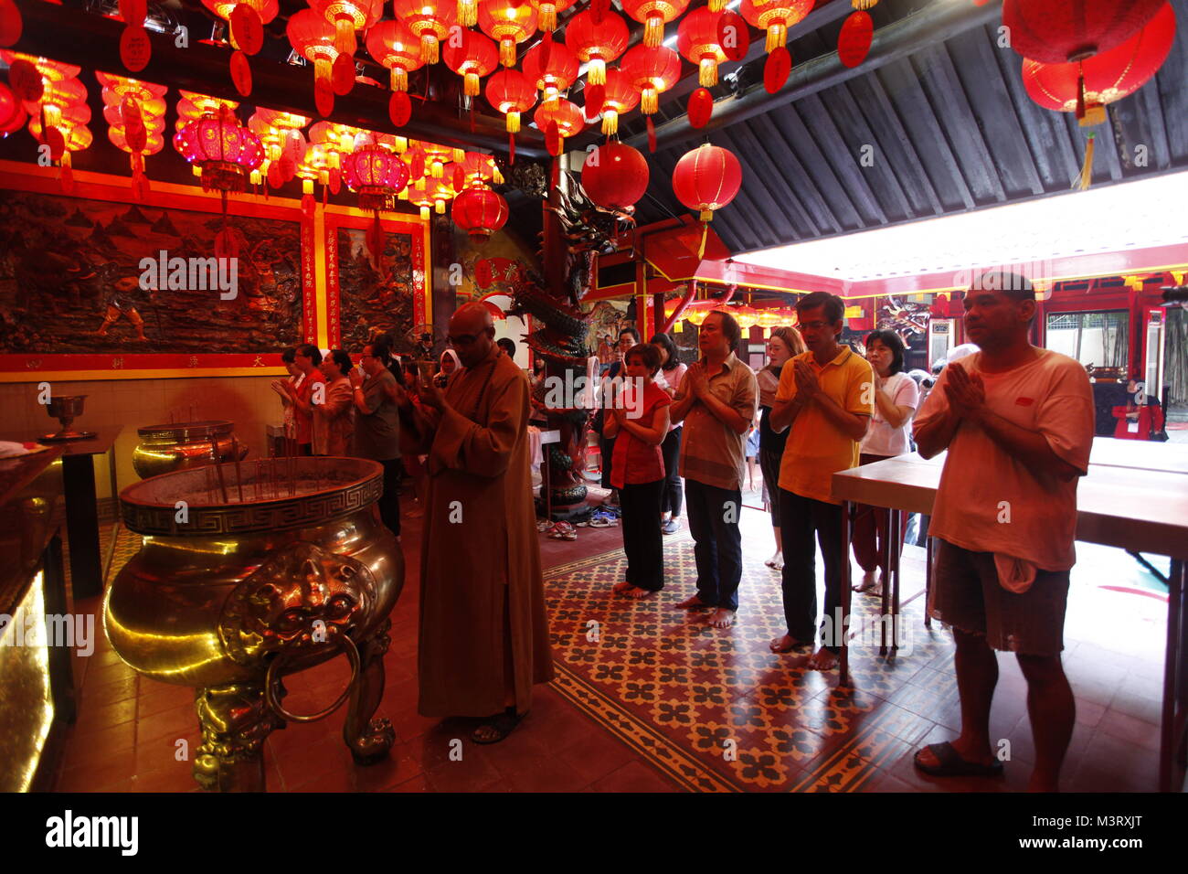Bogor, Indonesia. 11th Feb, 2018. Buddhists pray before cleaning altars ...