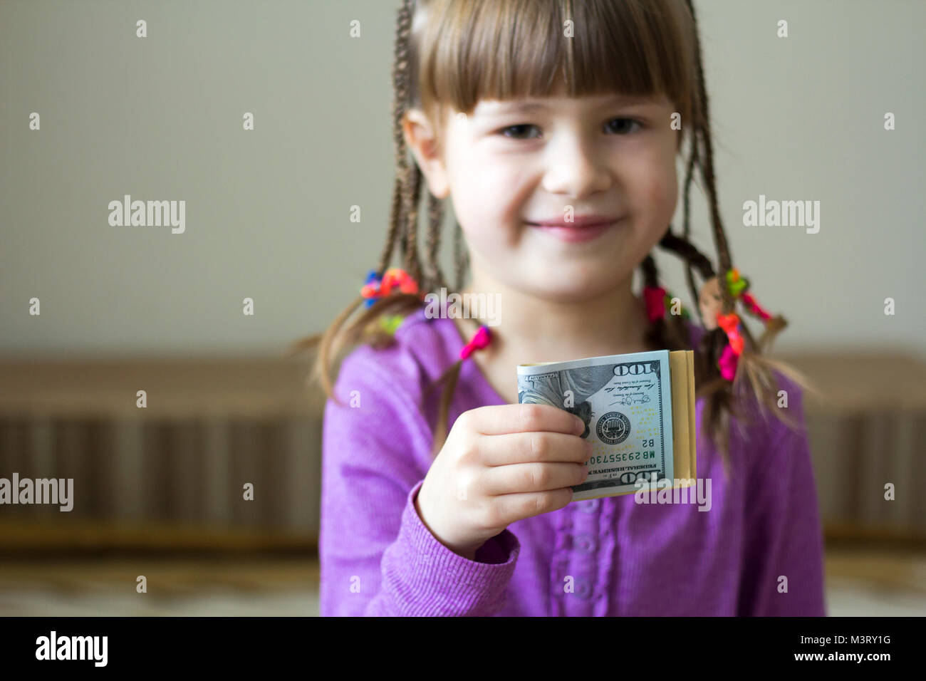 Money, finances and people concept - smiling little girl with dollar ...