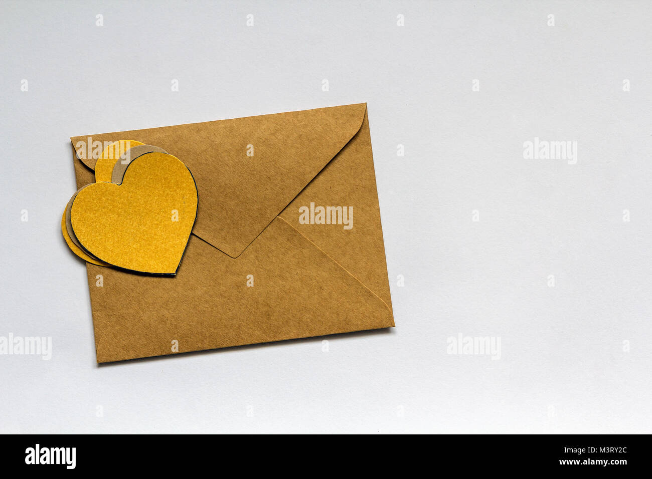 Love letter envelope with paper hearts on white background. Happy ...