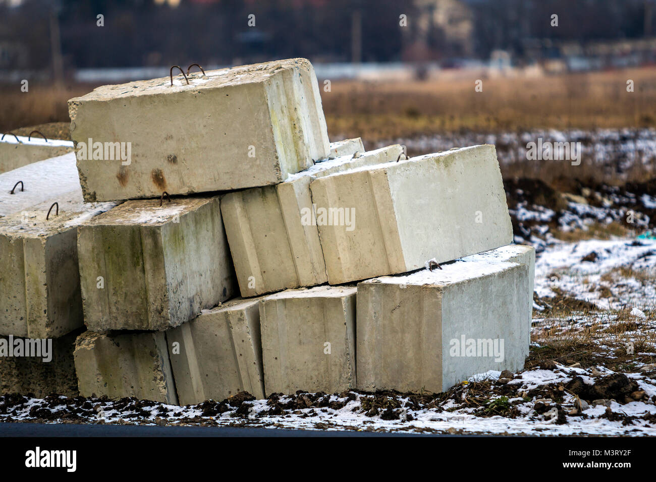 Stack of concrete blocks for foundation on construction site ...