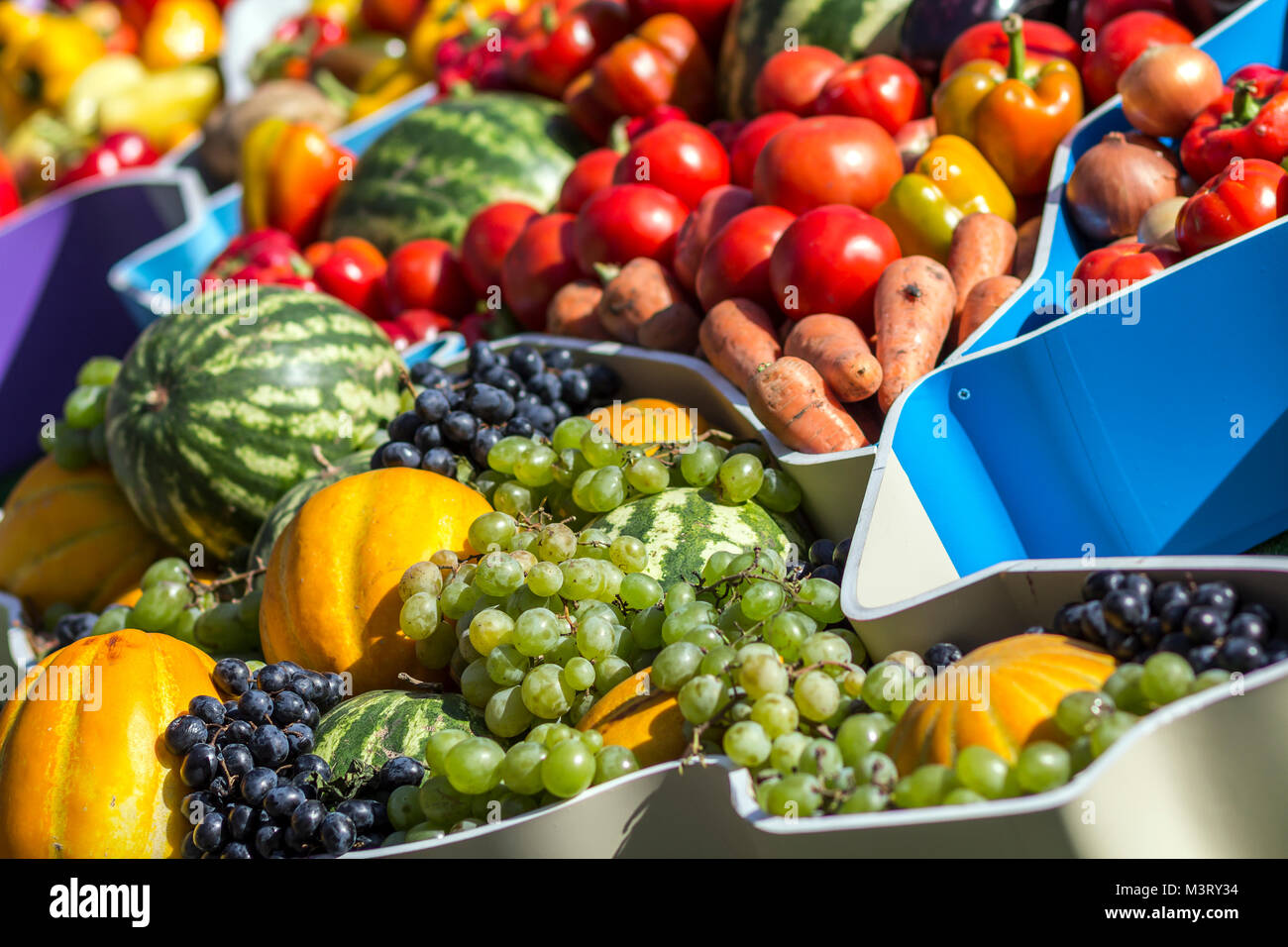 Farmers fruit market with various colorful fresh fruits and vegetables ...