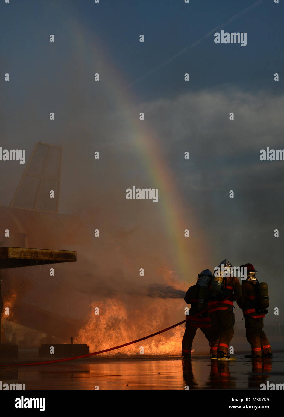 A rainbow appears as three Airmen assigned to the 312th Training ...