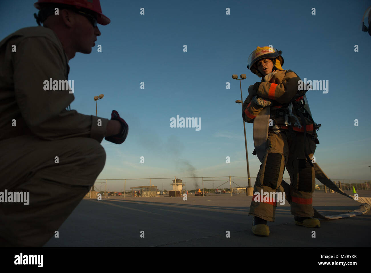 U.S. Army SSG Jeremy Lorton encourages U.S. Air Force Airman 1st Class ...