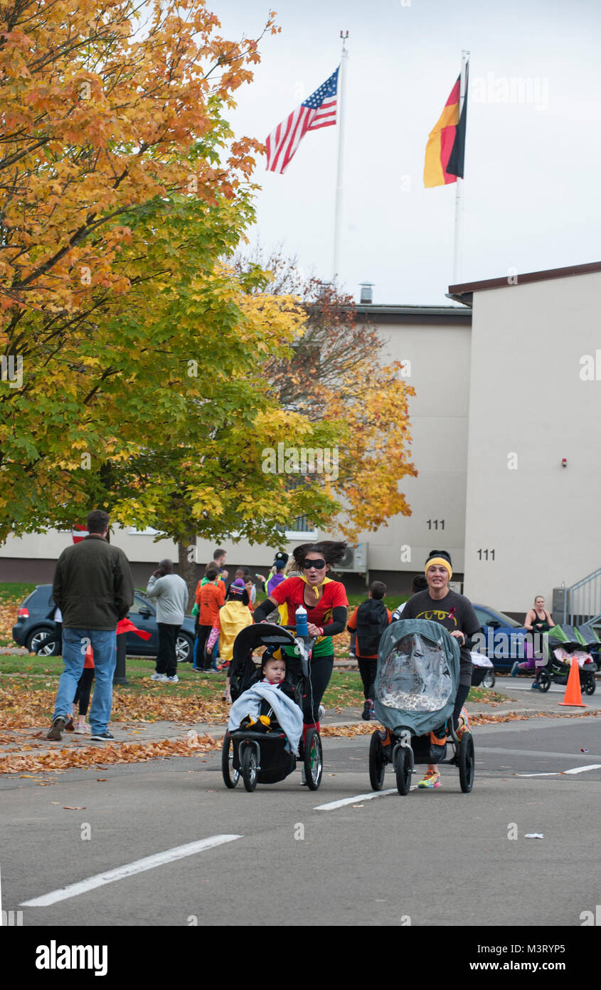 Runners participate in a Red Ribbon Run Superhero 5k event at Sembach ...