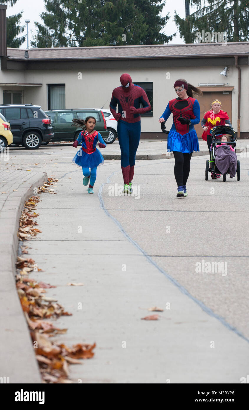 Runners participate in a Red Ribbon Run Superhero 5k event at Sembach ...
