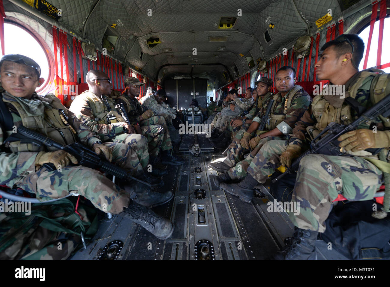 Belizean security forces members ride aboard a U.S. Army CH-47 Chinook ...