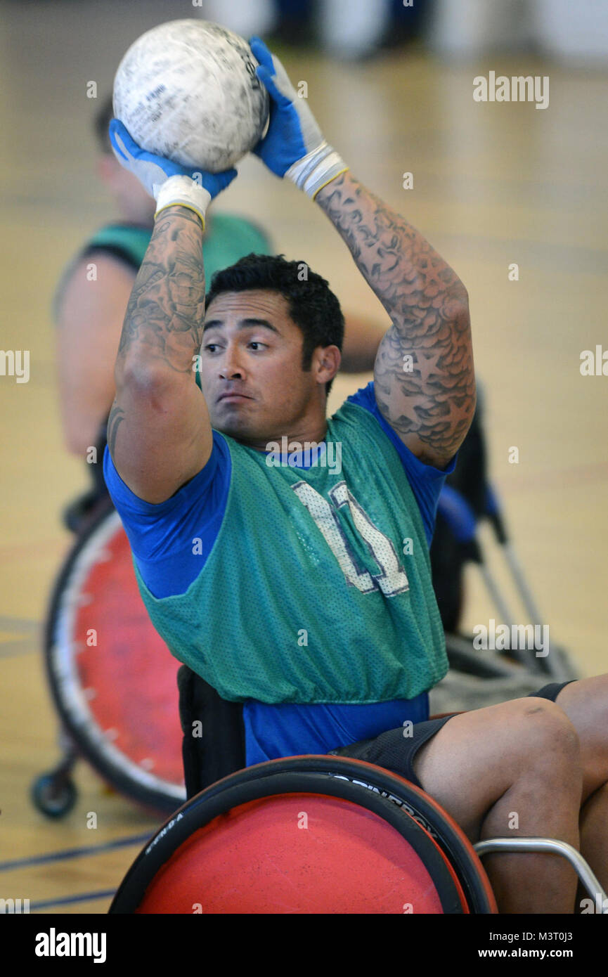 Wounded Warrior Wheelchair Rugby player passes the ball during ...