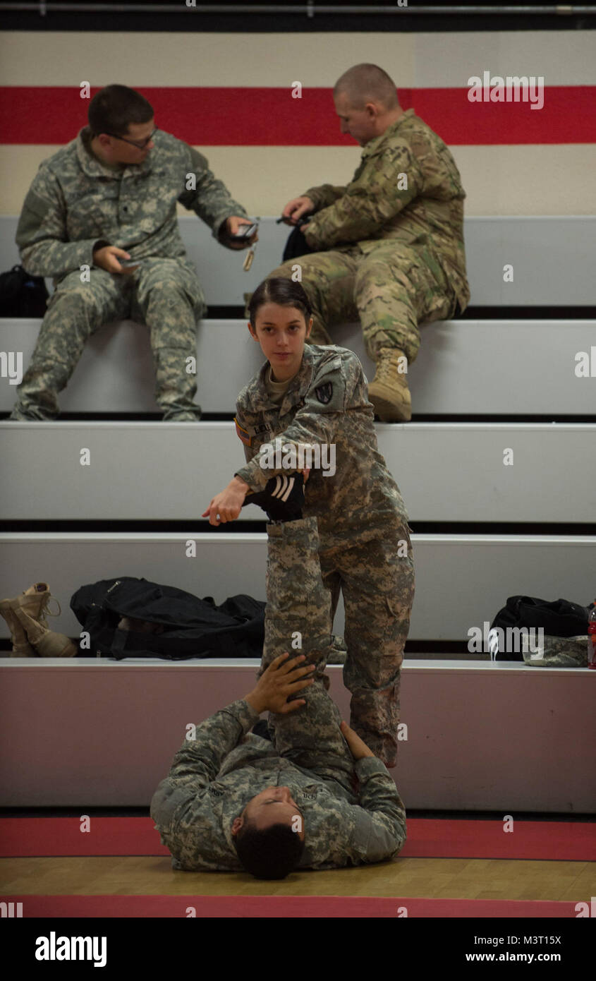 U.S. Army Soldiers stretch prior to competing in a 7th Mission Support ...