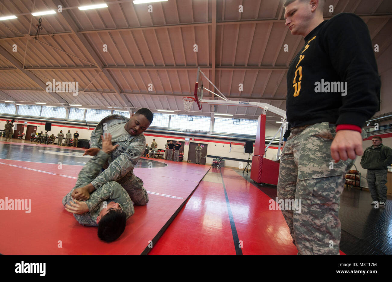 U.S. Air Force Senior Amn Christopher Minter (left) bouts with a ...