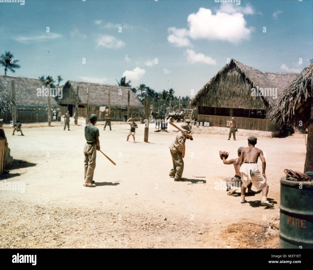 80-G-K-6644: Japanese POWs playing baseball at a Guam POW stockade ...