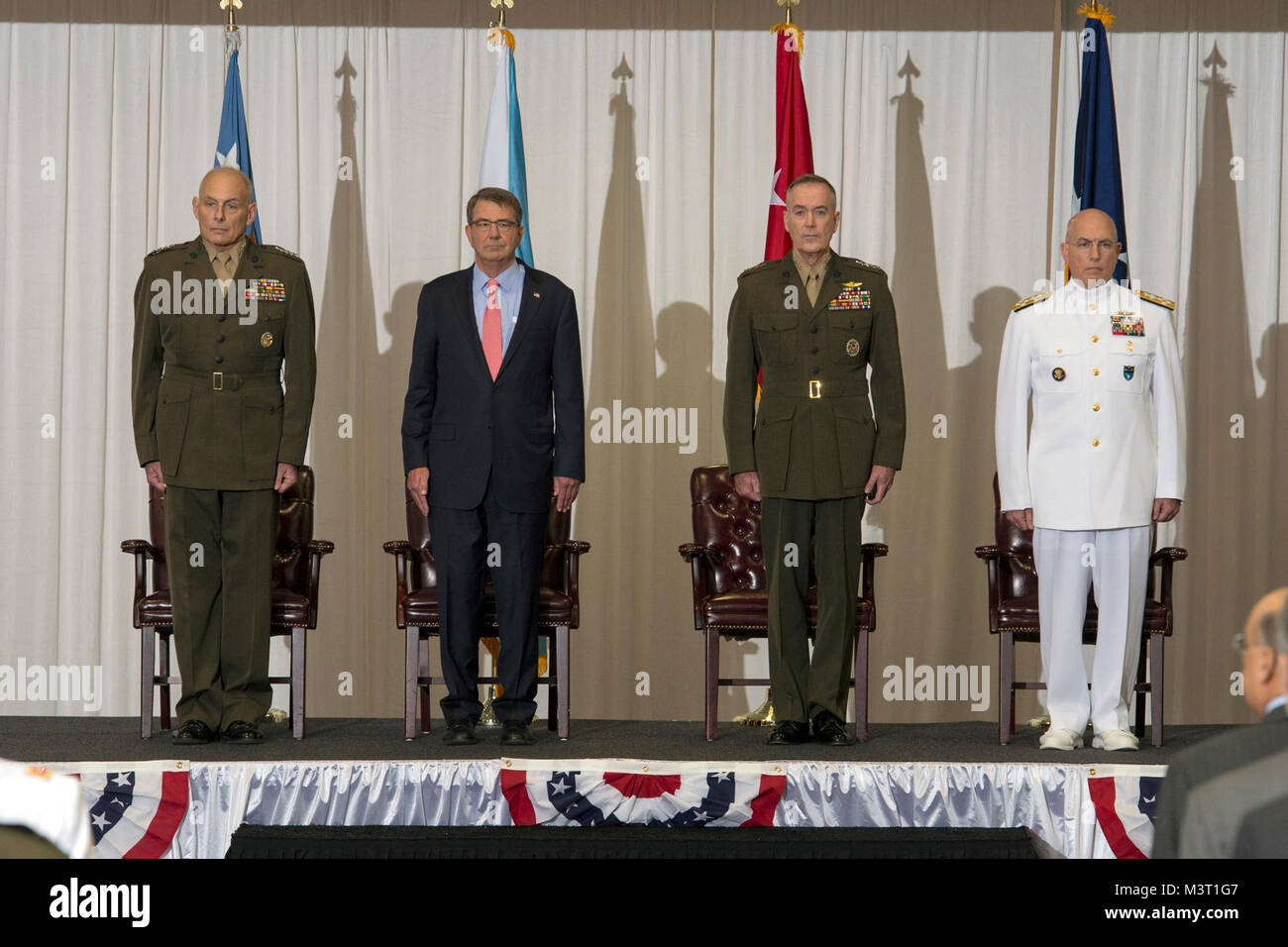 The official party stands at attention during the during the change of ...
