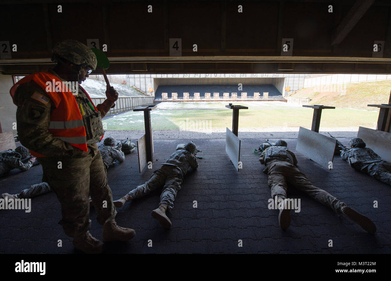 U.S. Army Soldiers prepare to fire their M-16 assault rifles during a ...