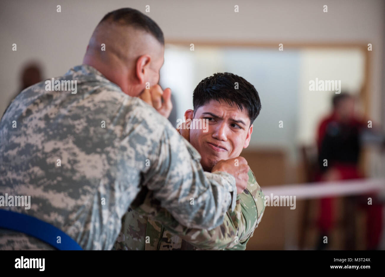 U.S. Army Private 1st Class Victor Rodriguez grapples with an opponent ...