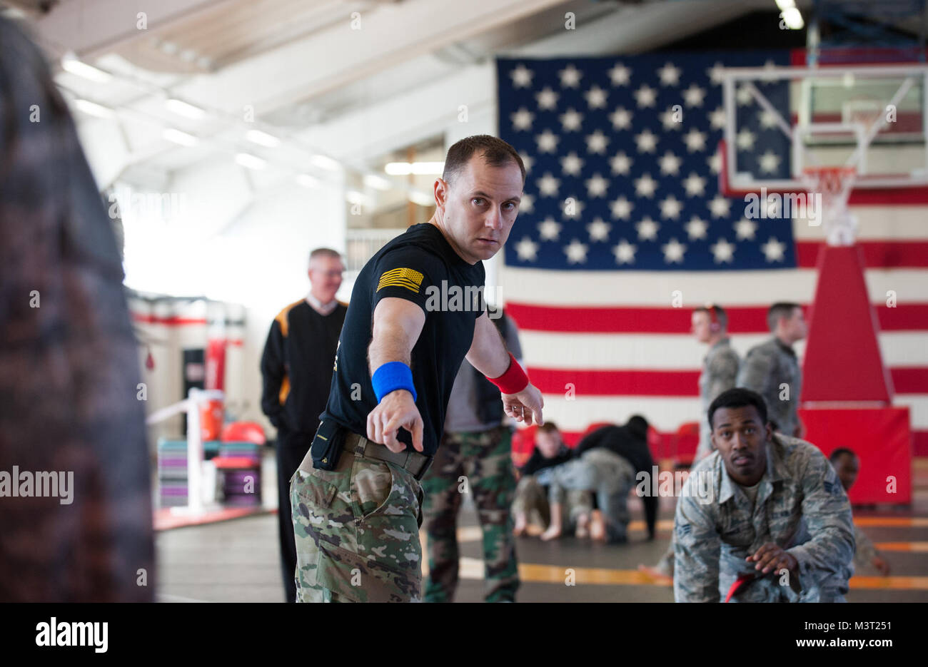 Army Master Sgt. Richard Silva, an army combatives instructor, points ...