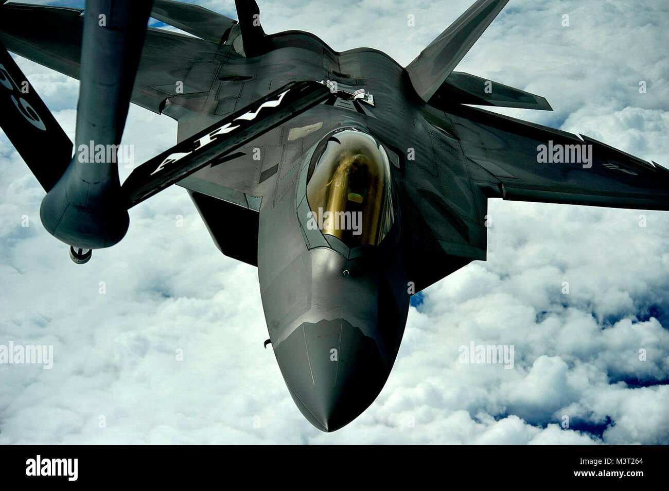 An F-22 Raptor pilot positions the aircraft to accept fuel from a KC ...