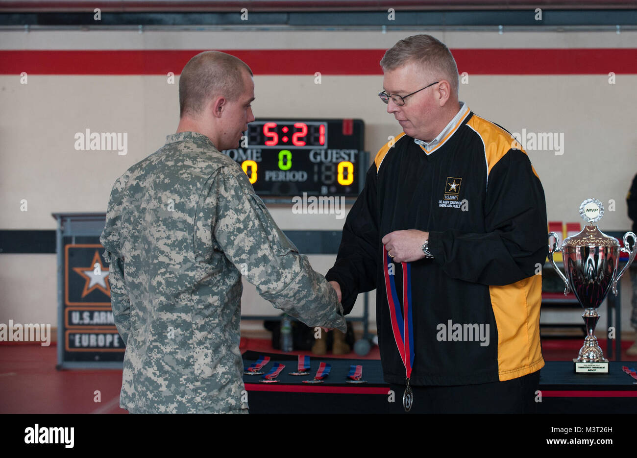 U.S. Army Specialist Eric Hartley (left) receives a 2nd place medal for ...
