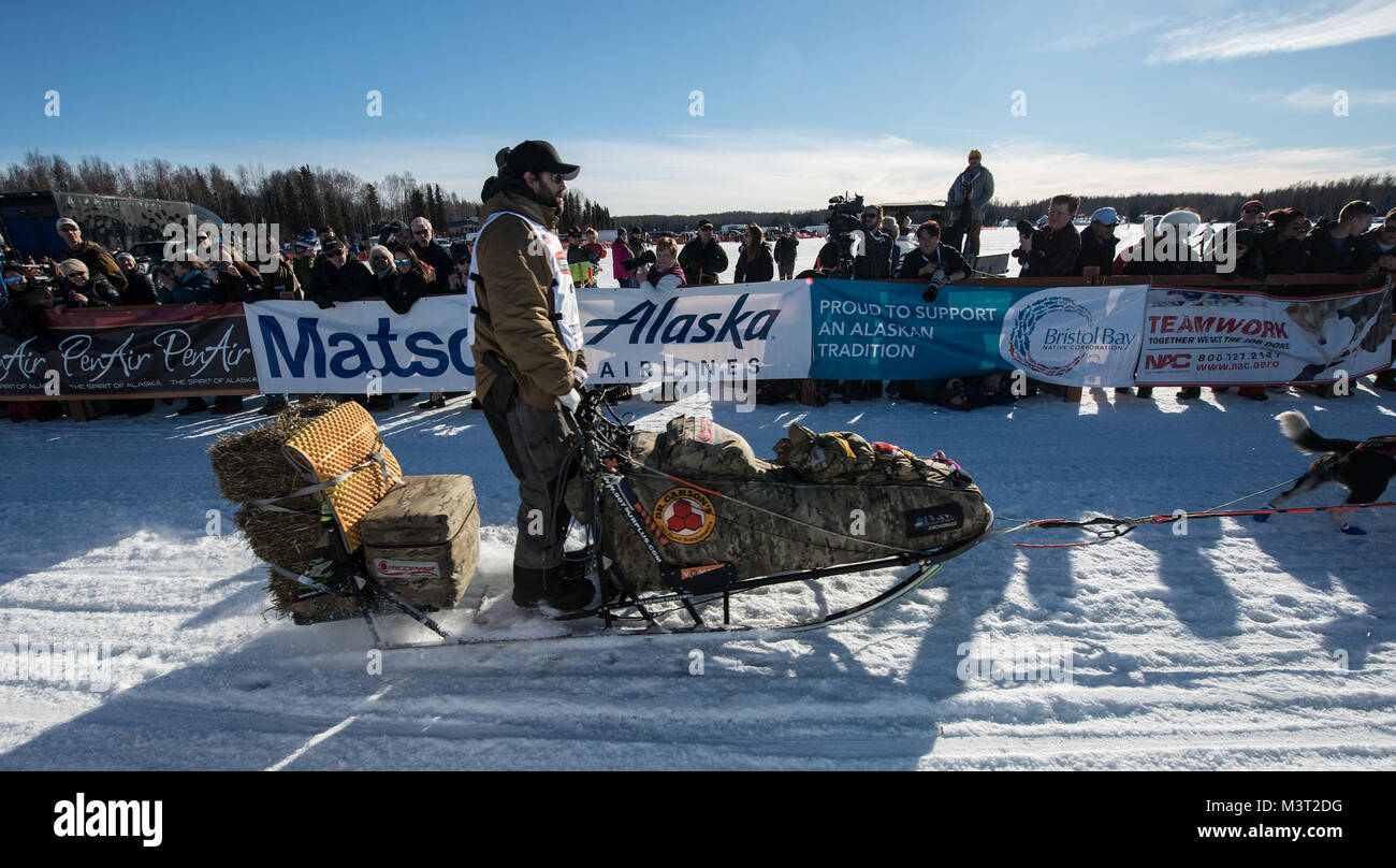 The Battle Dawgs sled dog team races down the trail during the official ...