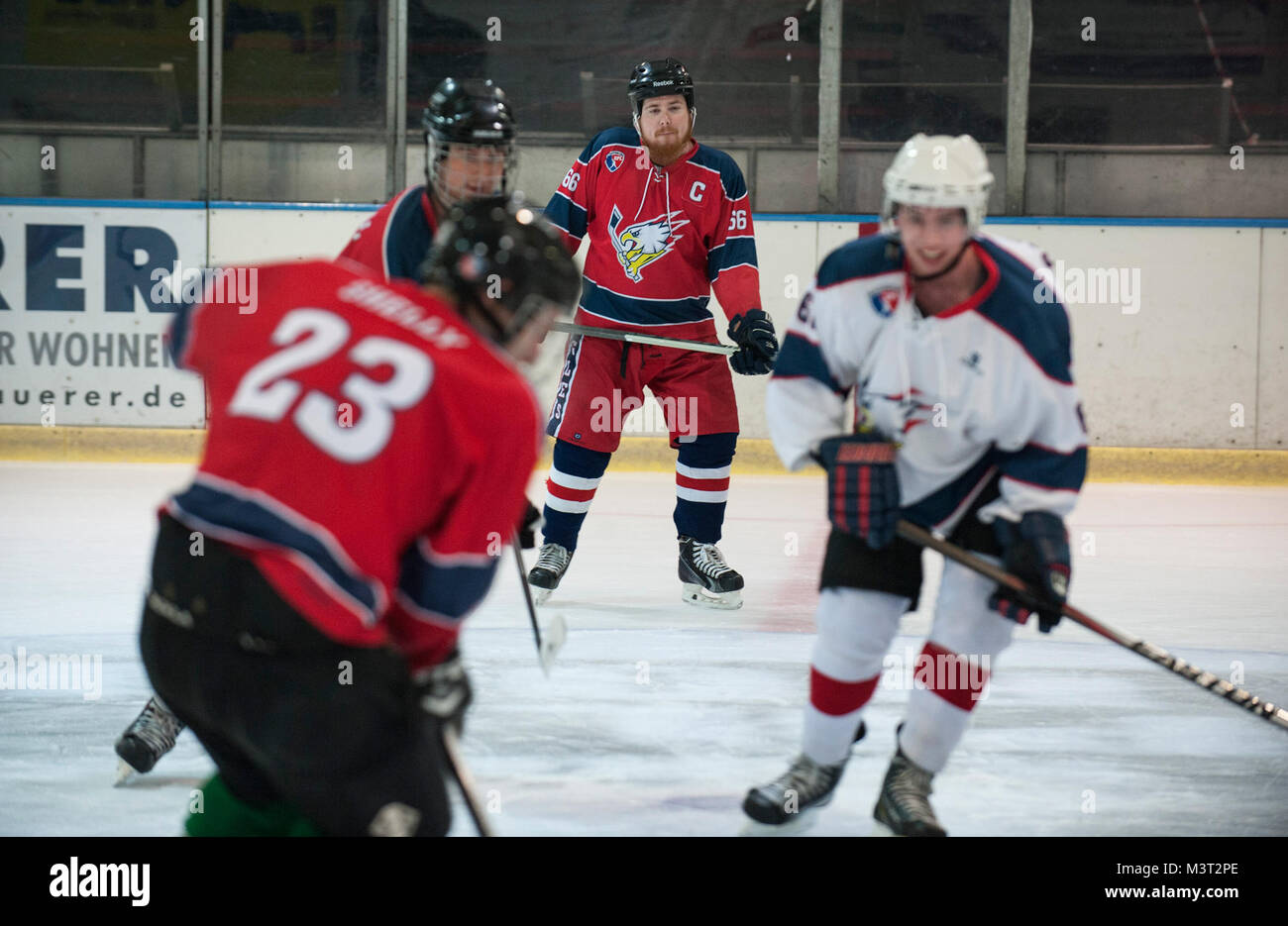 Eric Helgeson (center), a coach of the Kaiserslautern Military ...