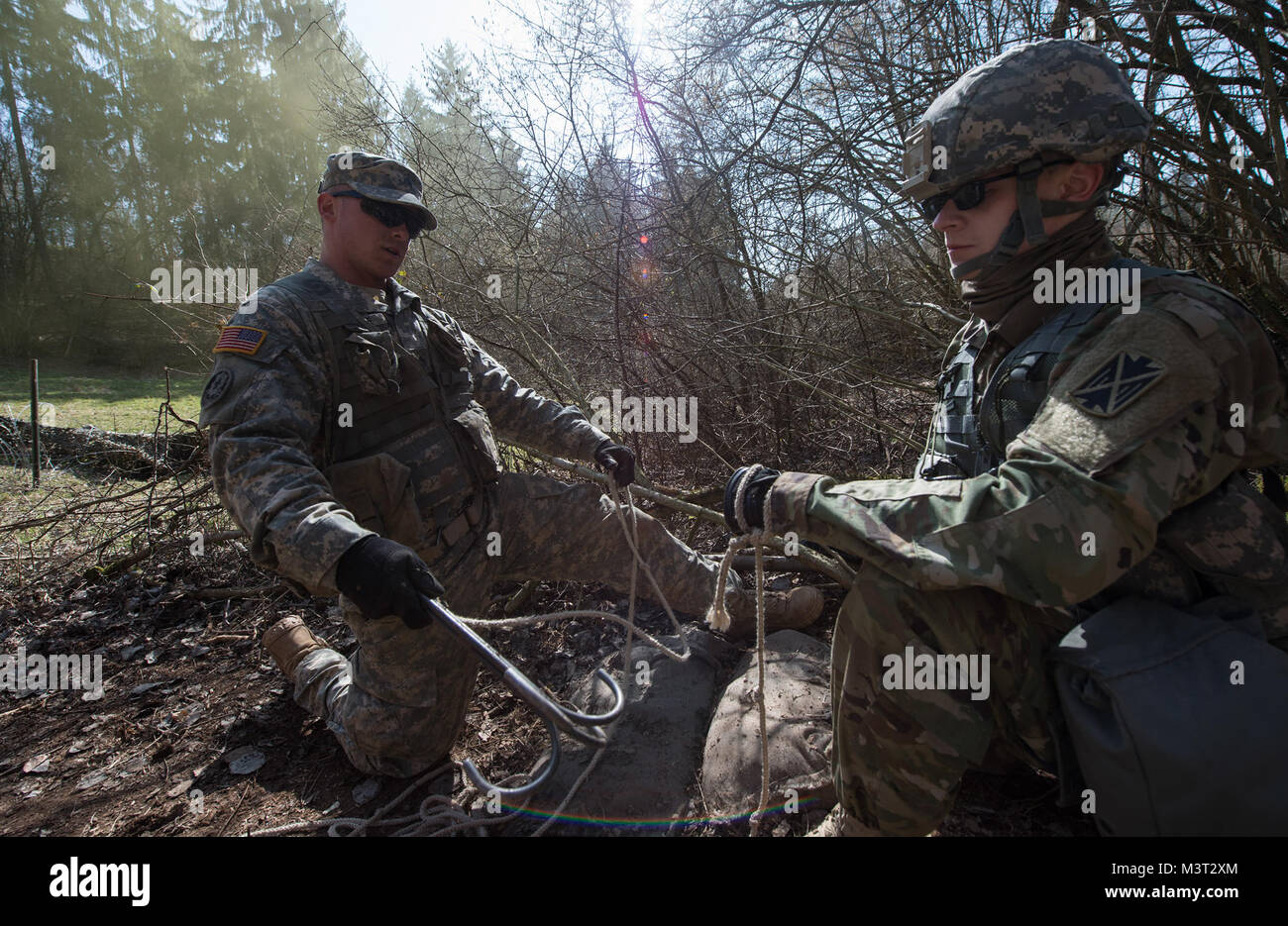 U.S. Army Specialist Brandon Mullins (right), a Health Care Specialist ...