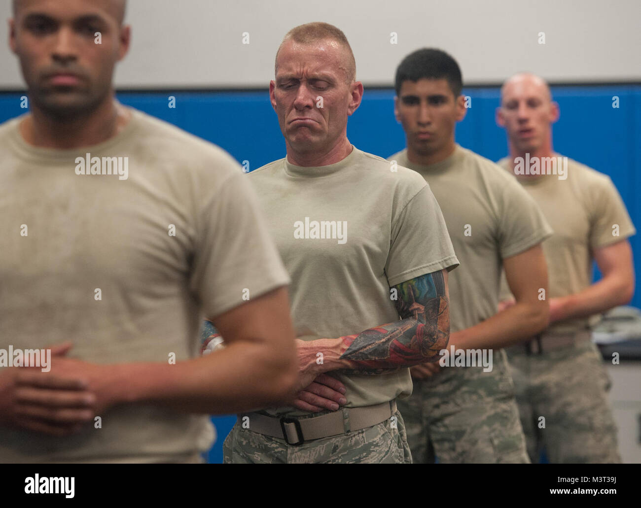 Security Forces patrolmen stand in the rest position as they wait for ...