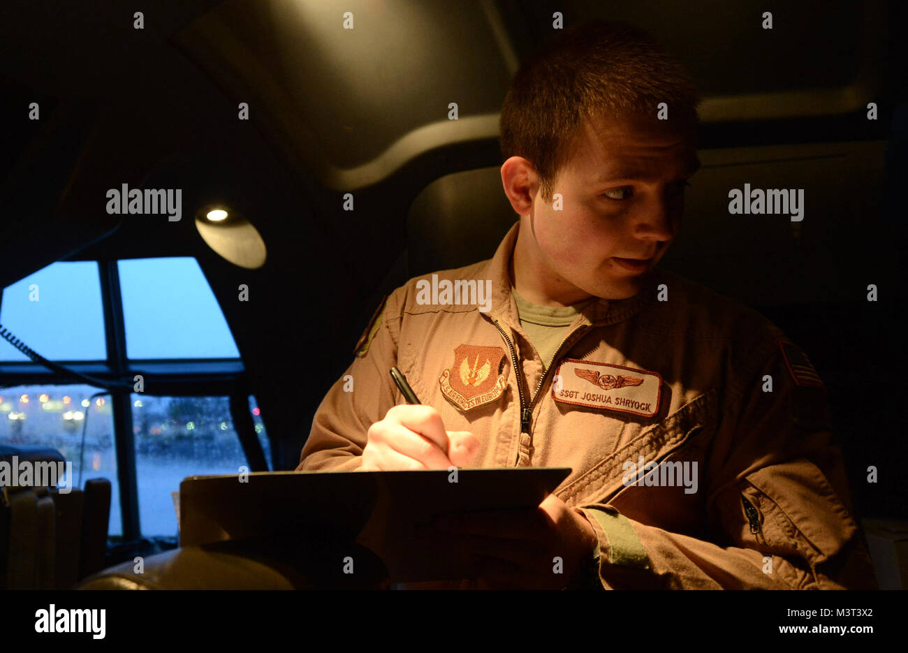 U.S. Staff Sergeant Joshua Shryock, a loadmaster with the 37th Airlift ...
