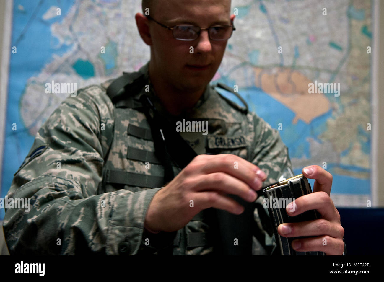 Grajewski loads a clip for his M16A2 before conducting foot patrols at ...