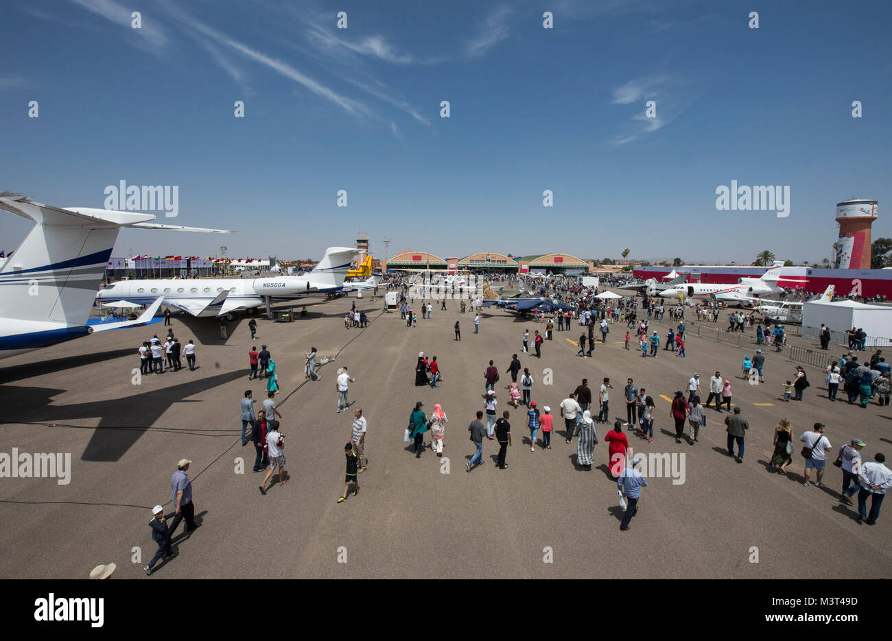 Spectators from around the world walk around static aircraft during the ...