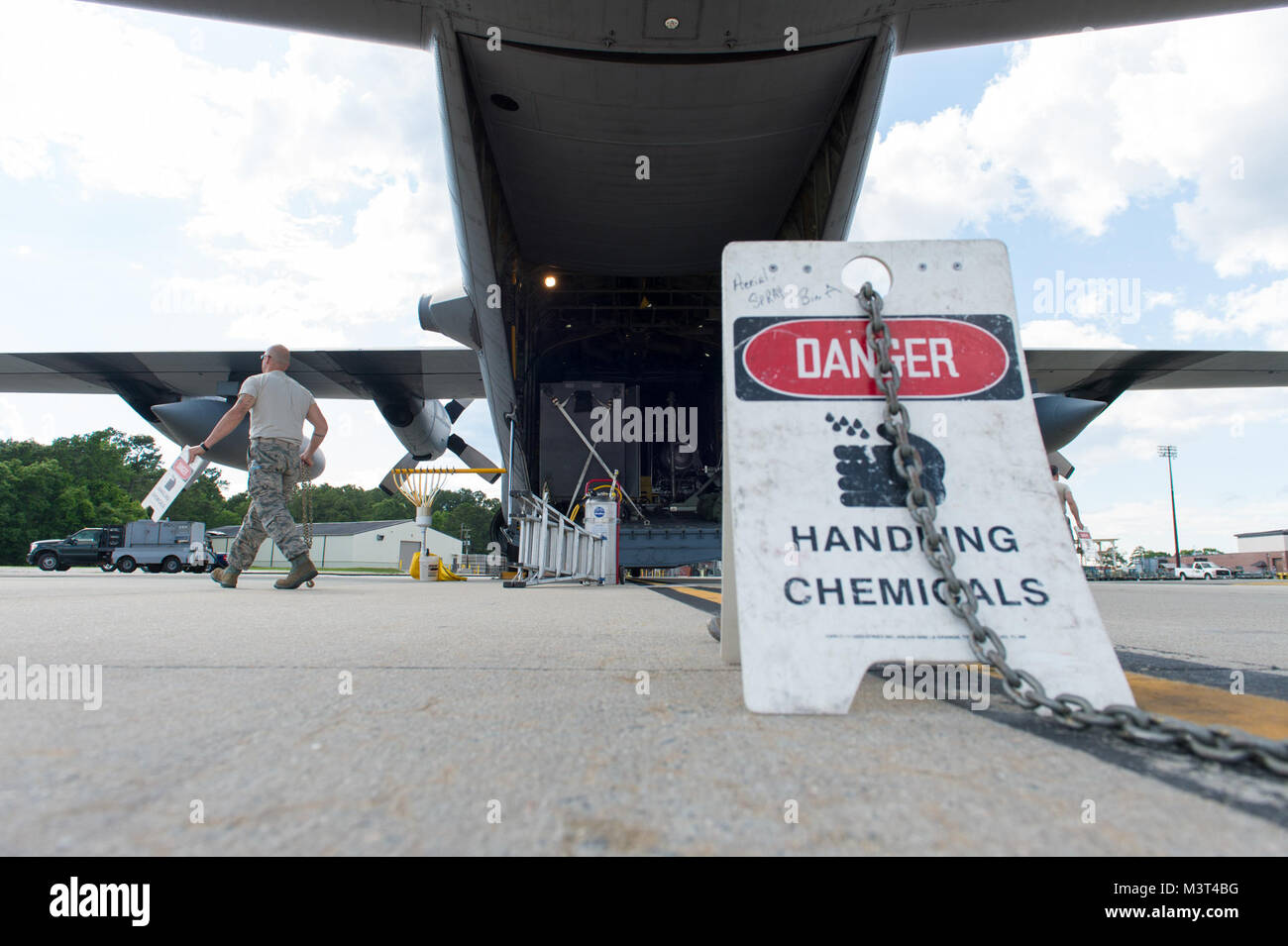 Signs are posted around a C-130 Hercules from the 910th Airlift Wing ...