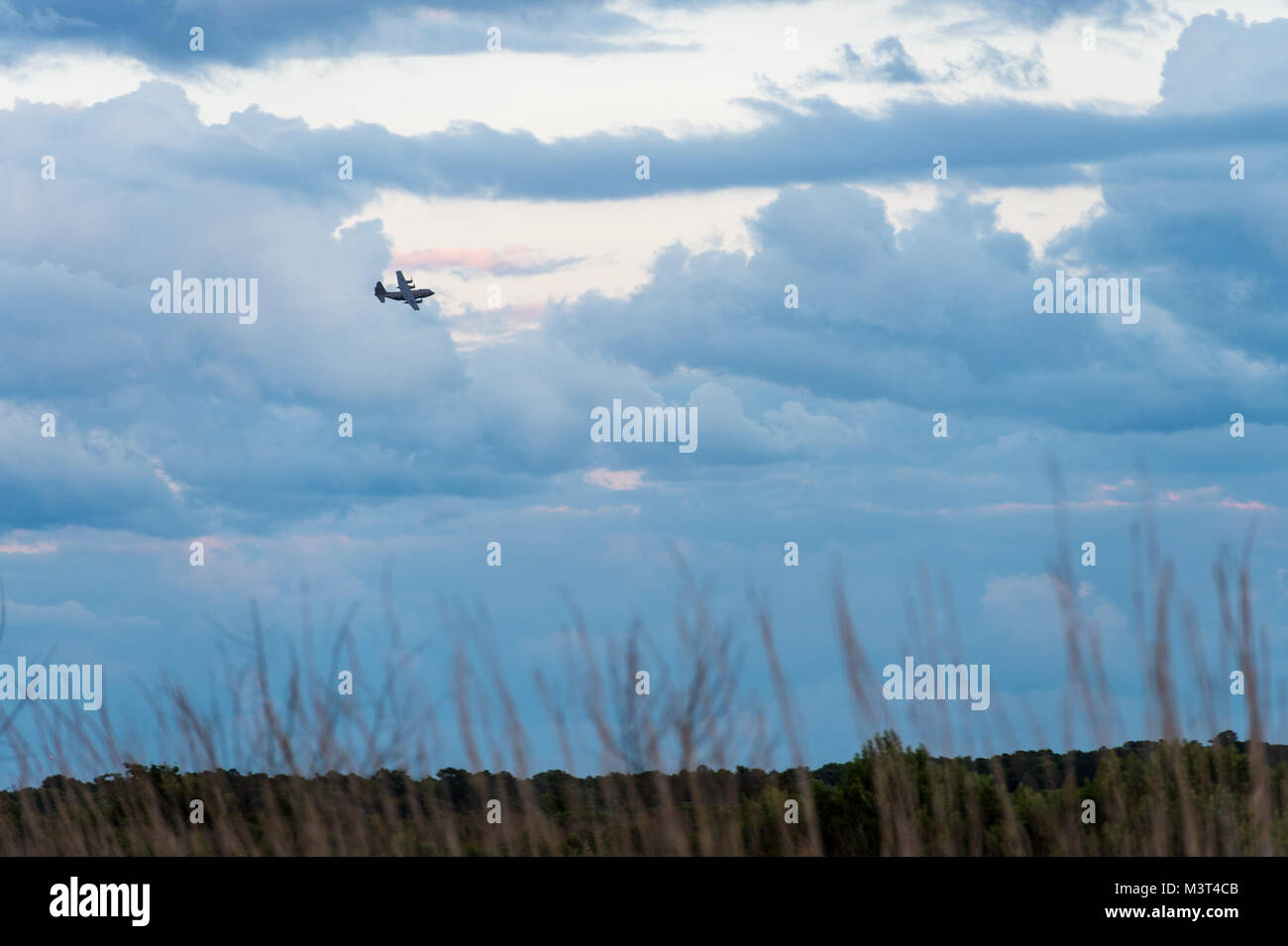 A C-130 Hercules flies an aerial spray mission at an altitude of 350 ...