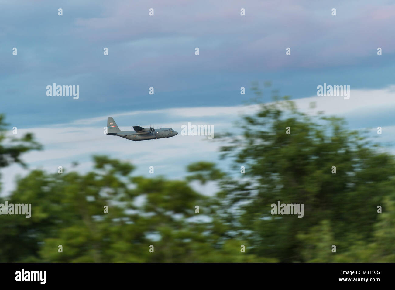 A C-130 Hercules flies an aerial spray mission at an altitude of 350 ...
