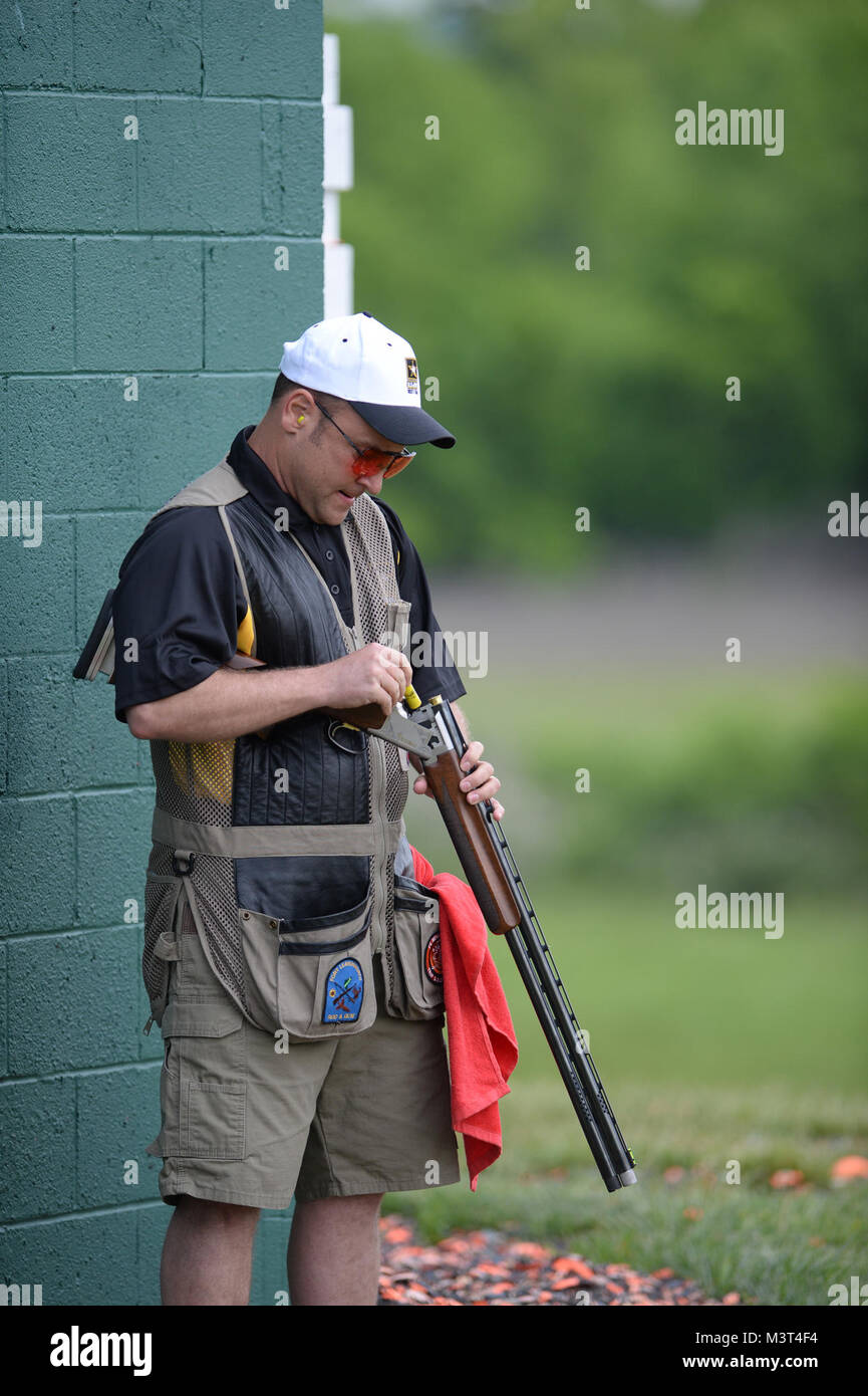Army Skeet Team member, Col. Steve Milton, loads his shotgun prior to ...