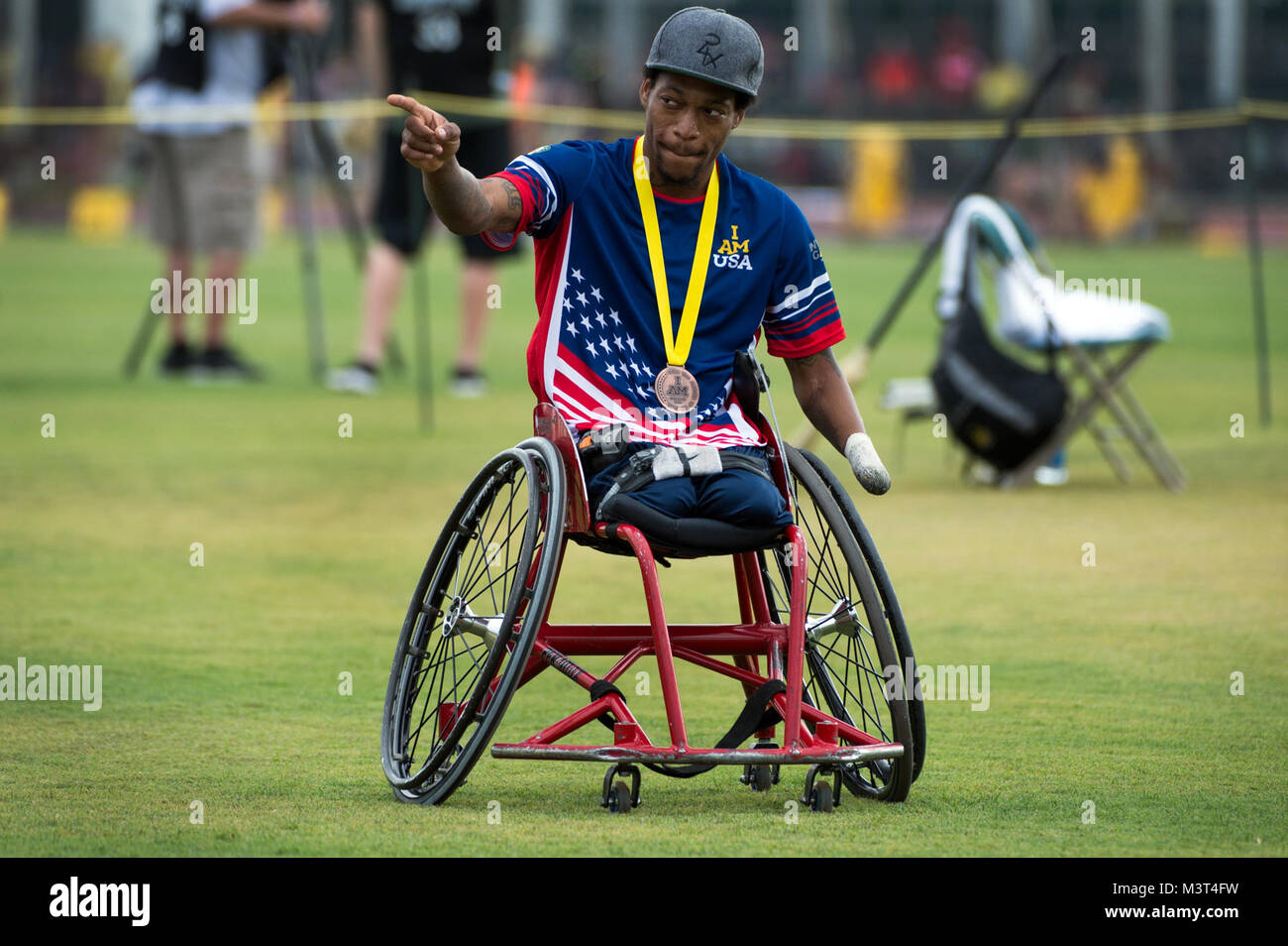 Retired Marine Corps Sgt. Anthony McDaniel gestures to a friend after ...