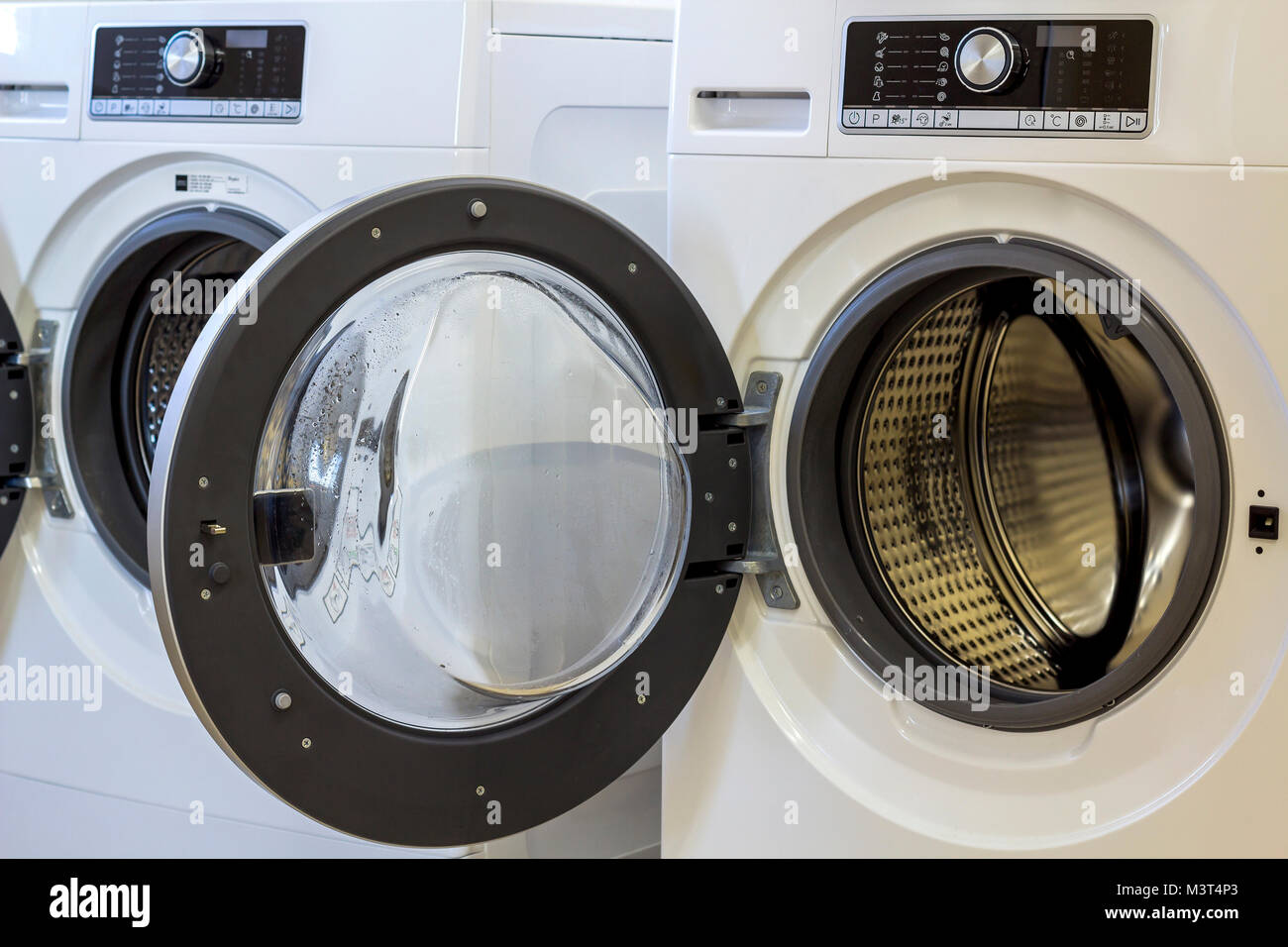A close up of open washing machine in bathroom Stock Photo - Alamy