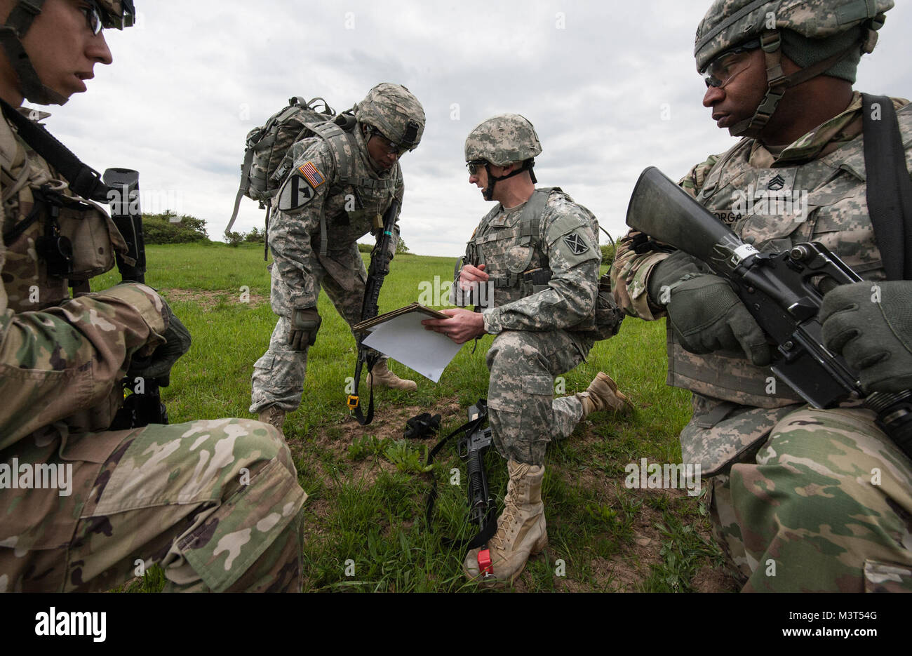 U.S. Army 2nd Lieutenant Brandt Ange (center right), a competitor in ...