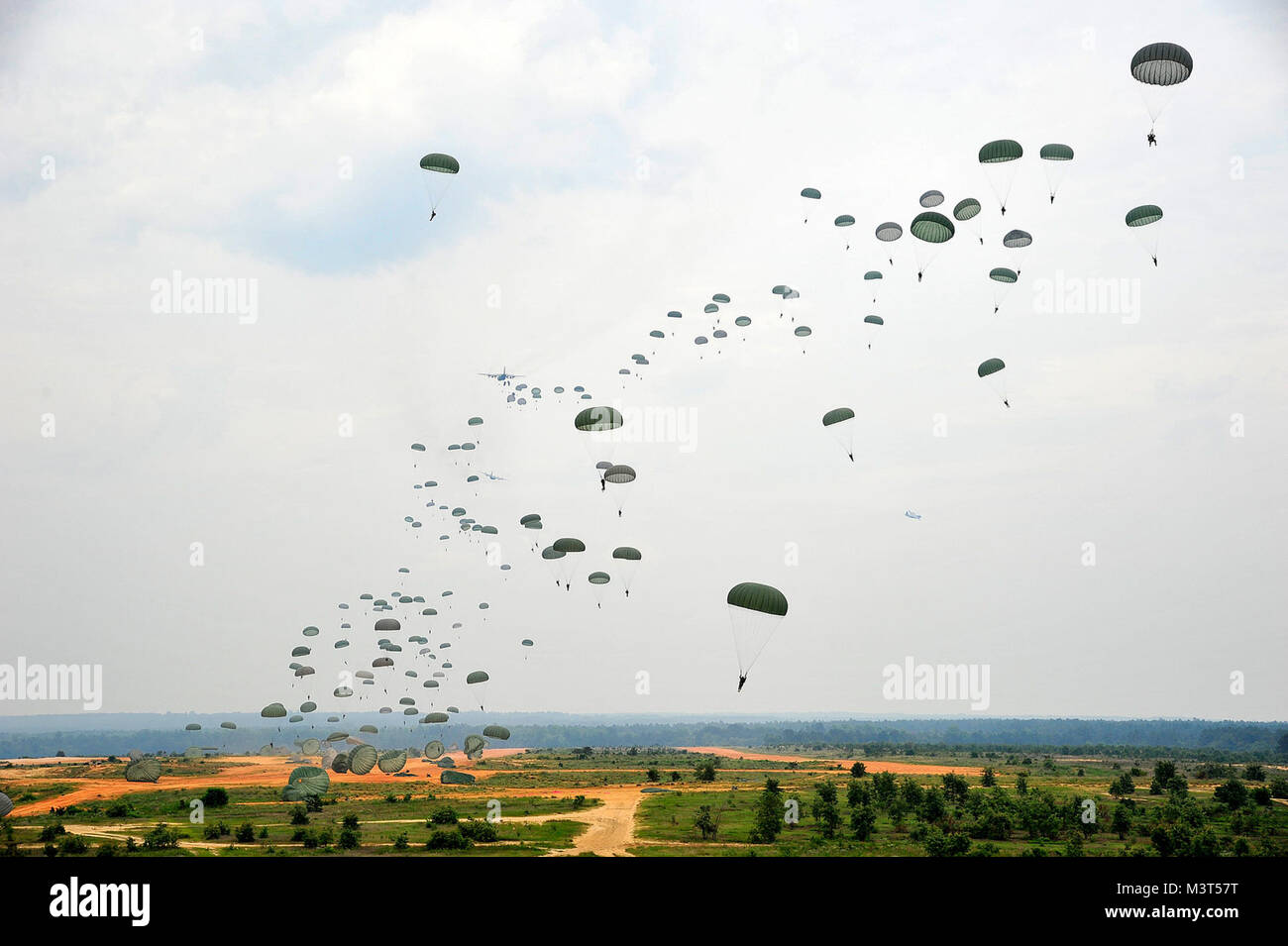 A C-130 Hercules drops Army paratroopers assigned to the 82nd Airborne ...