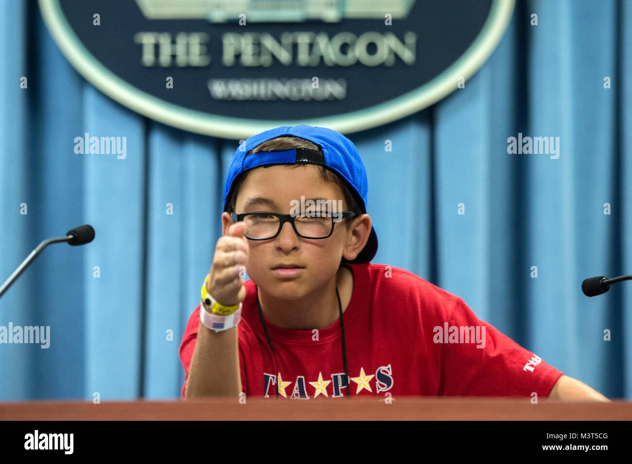 Kyle Washington imitates a speaker in the Pentagon Briefing Room during ...
