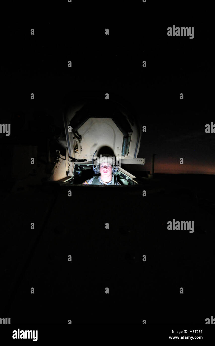 An Army M2A1 Bradley Infantry Fighting Vehicle driver waits for ...