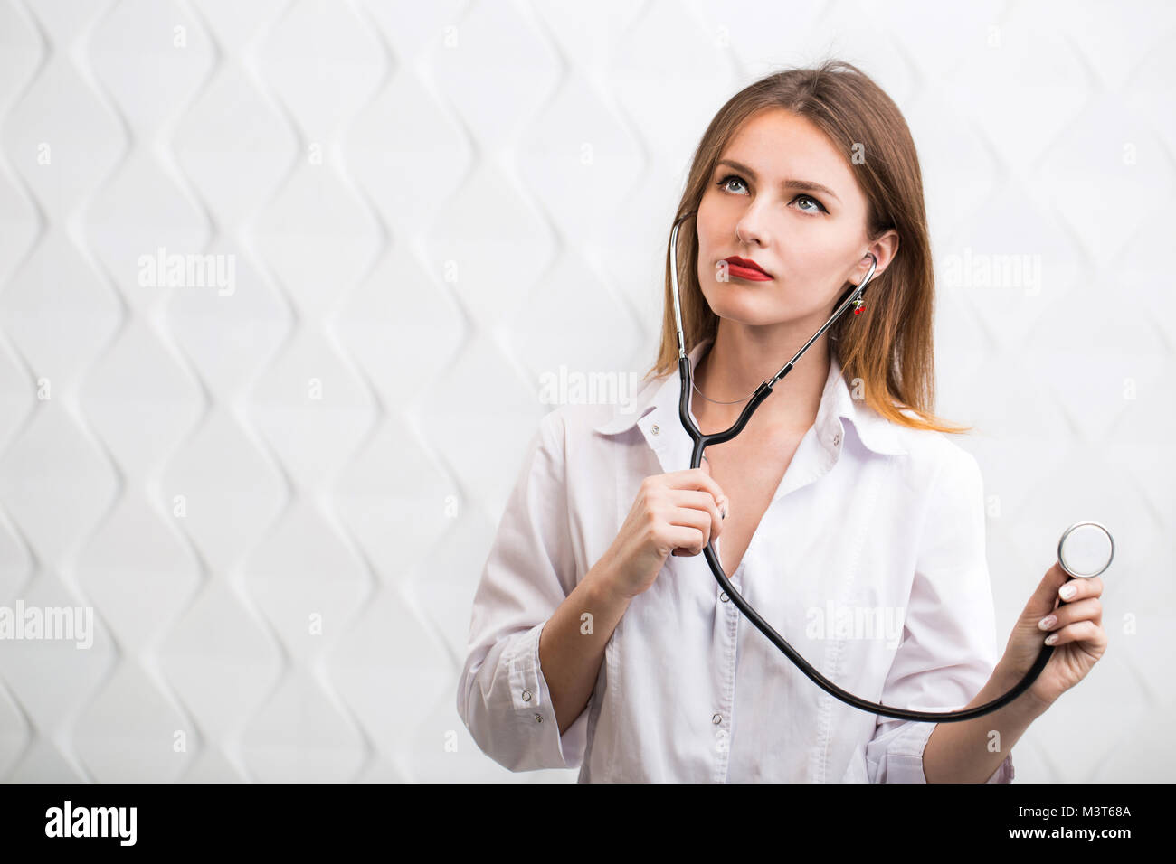 Female Doctor Uses Stethoscope Stock Photo - Alamy